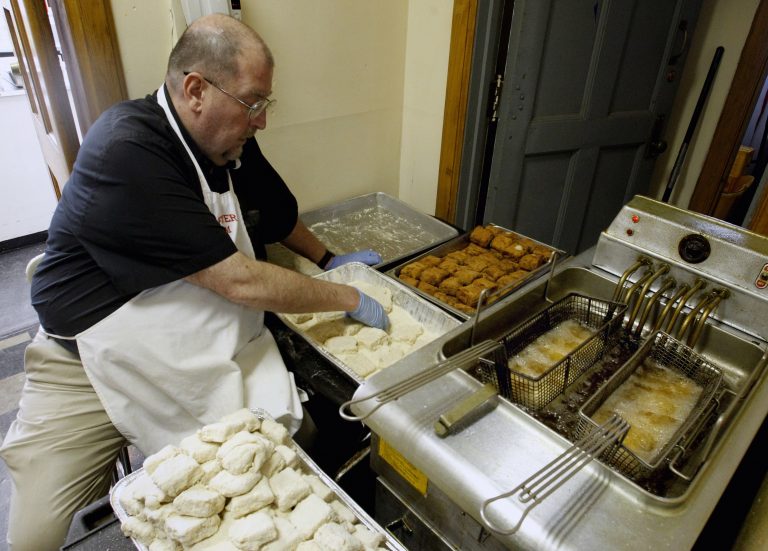 Pastor prepares fish during Friday fish fry at Pennsylvania church ...