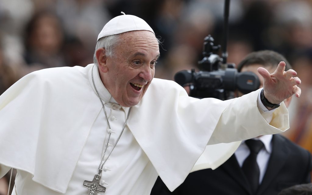 Pope greets people as he arrives for general audience in St. Peter's ...