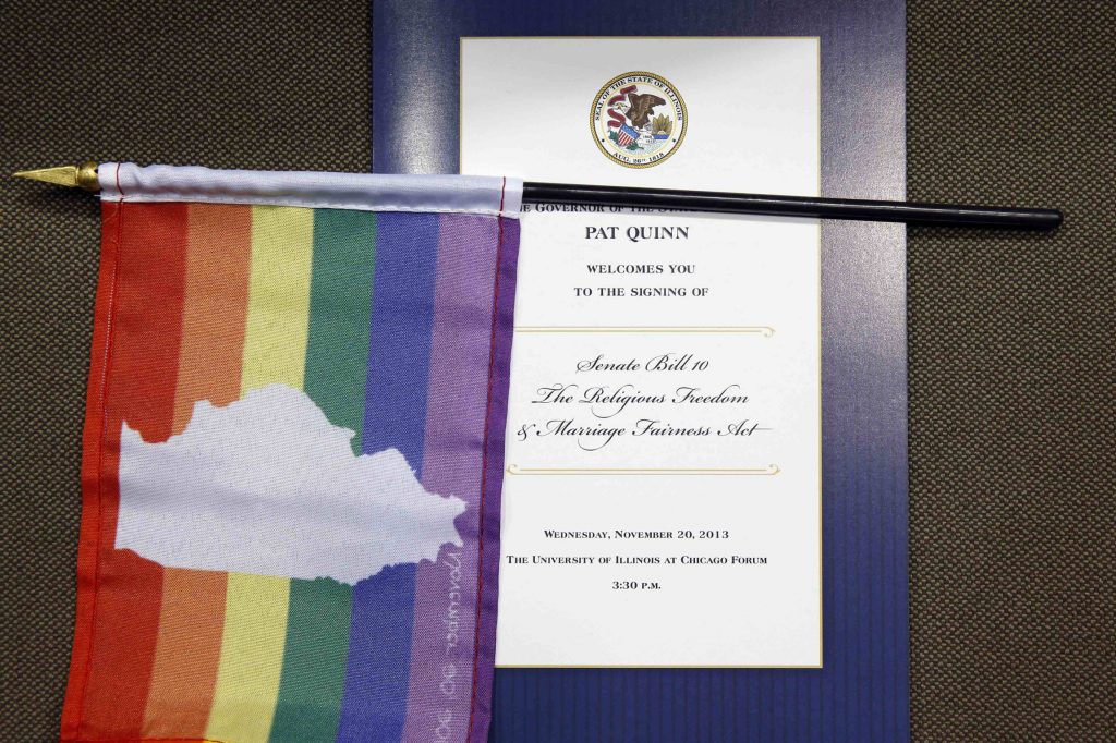 Flag seen overlaying program for ceremony marking signing of Illinois ...