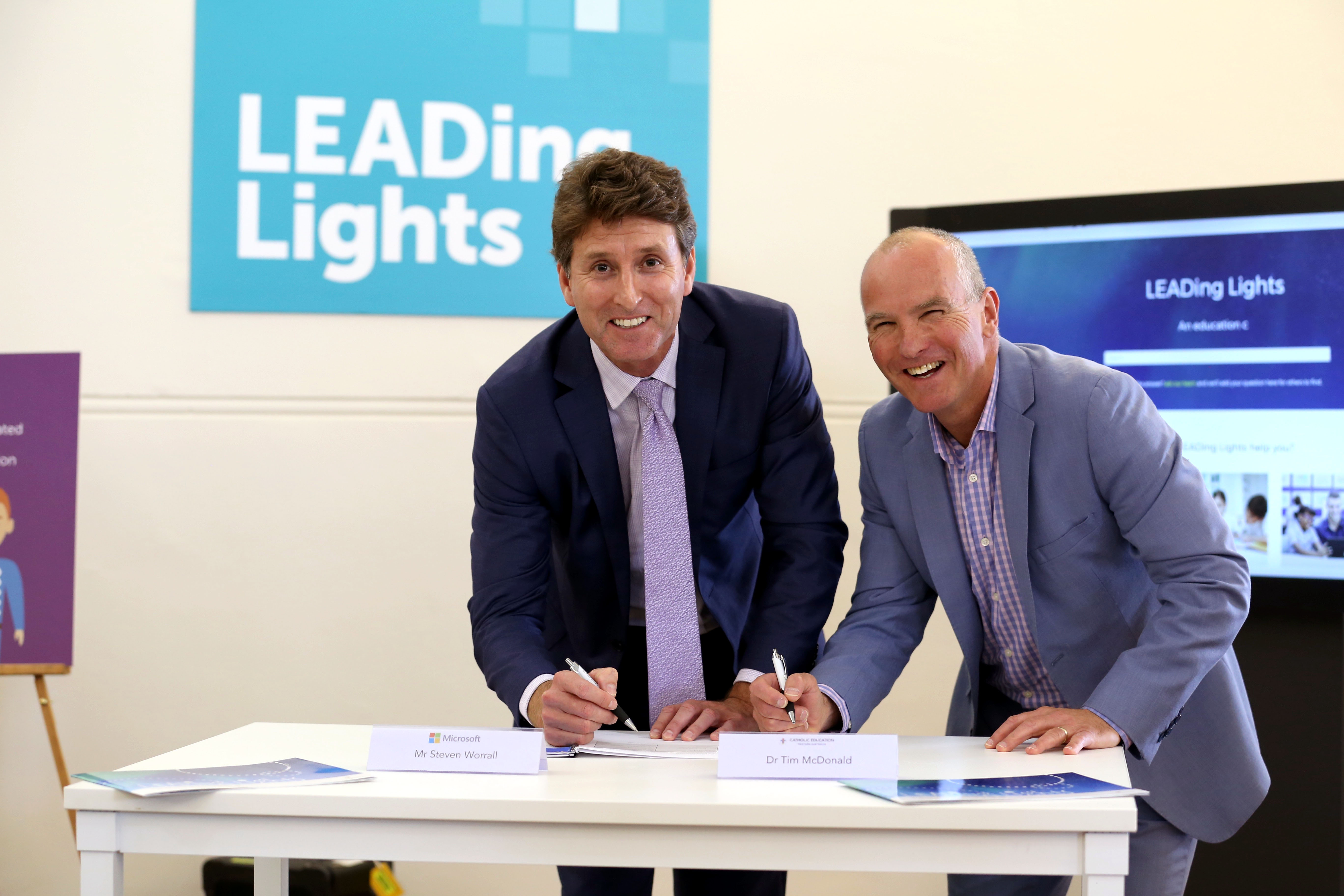 Steven Worrall and Tim McDonald signing agreement_web | The Record